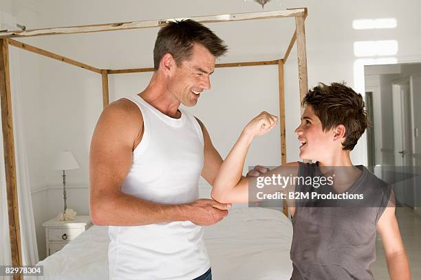 Father And Son Muscle Photos And Premium High Res Pictures Getty Images