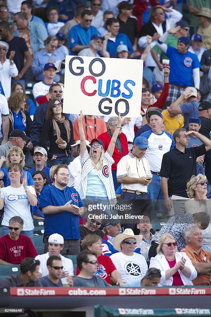 Chicago Cubs fans with GO CUBS GO sign in stands during game vs... News ... Chicago Cubs fans with GO CUBS GO sign in stands during game vs... News ...