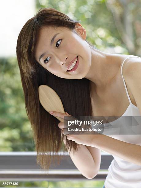 Asian Woman Brushing Hair Photos And Premium High Res Pictures Getty Images