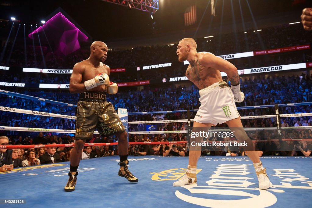 Conor Mcgregor In Action Leaning In And Taunting Vs Floyd Mayweather