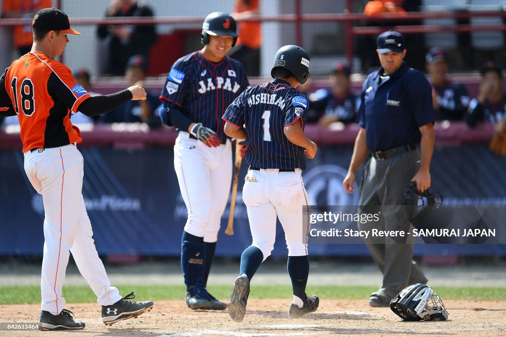 Kenji Nishimaki Of Japan Scores A Run During The Sixth Inning Of A