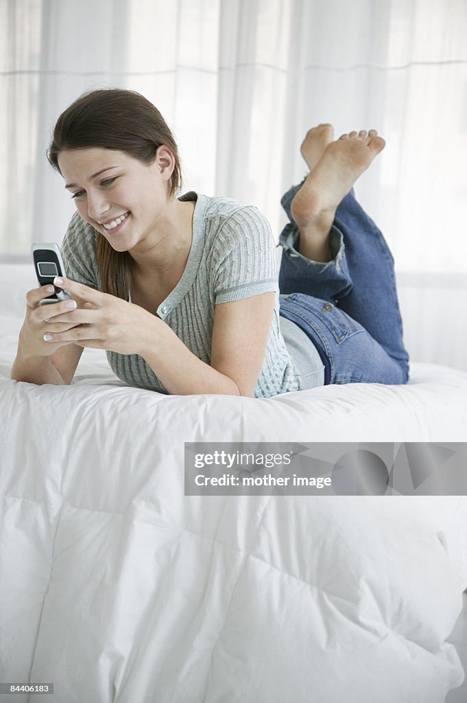 Teenage Girl On Bed Checking Text Messages High-Res Stock Photo - Getty ... Teenage Girl On Bed Checking Text Messages High-Res Stock Photo - Getty ...