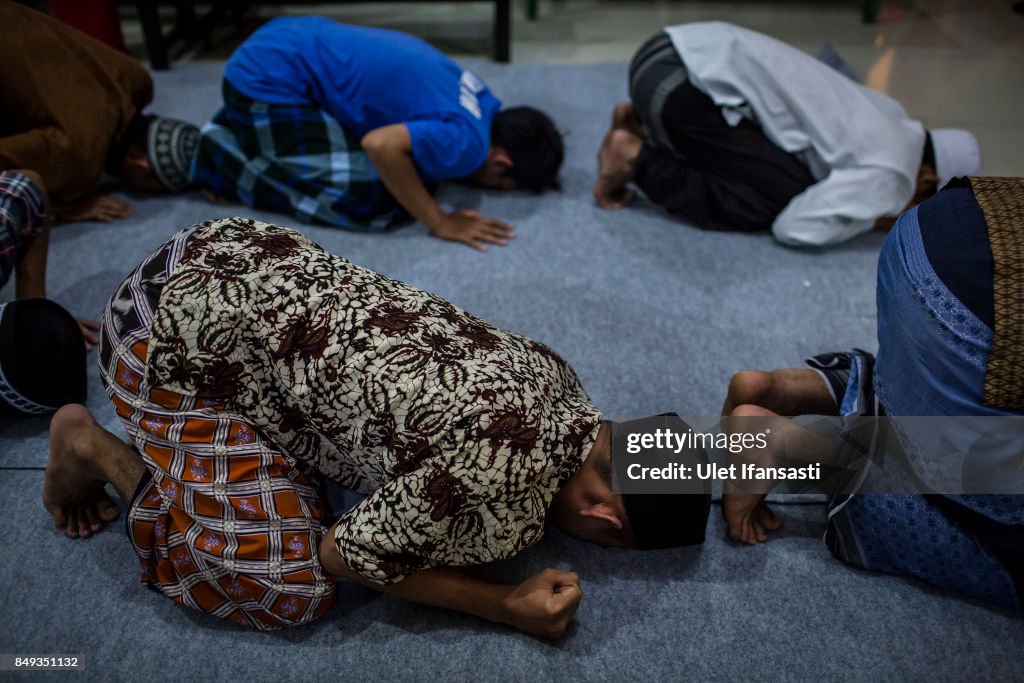 Recovering Drug Addicts Praying During A Prayer Session Led By Ustad