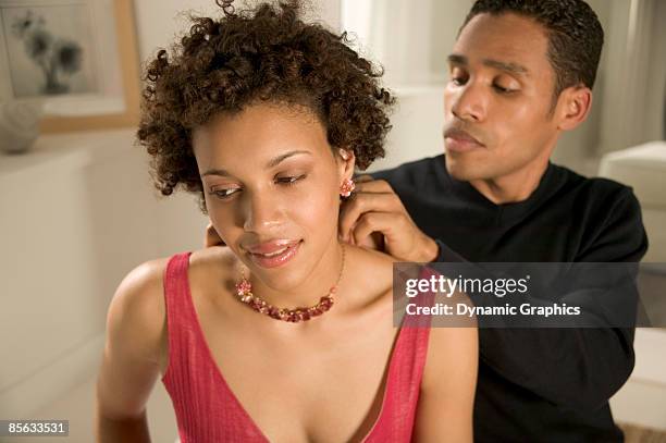 Man Putting Necklace On Woman Photos And Premium High Res Pictures