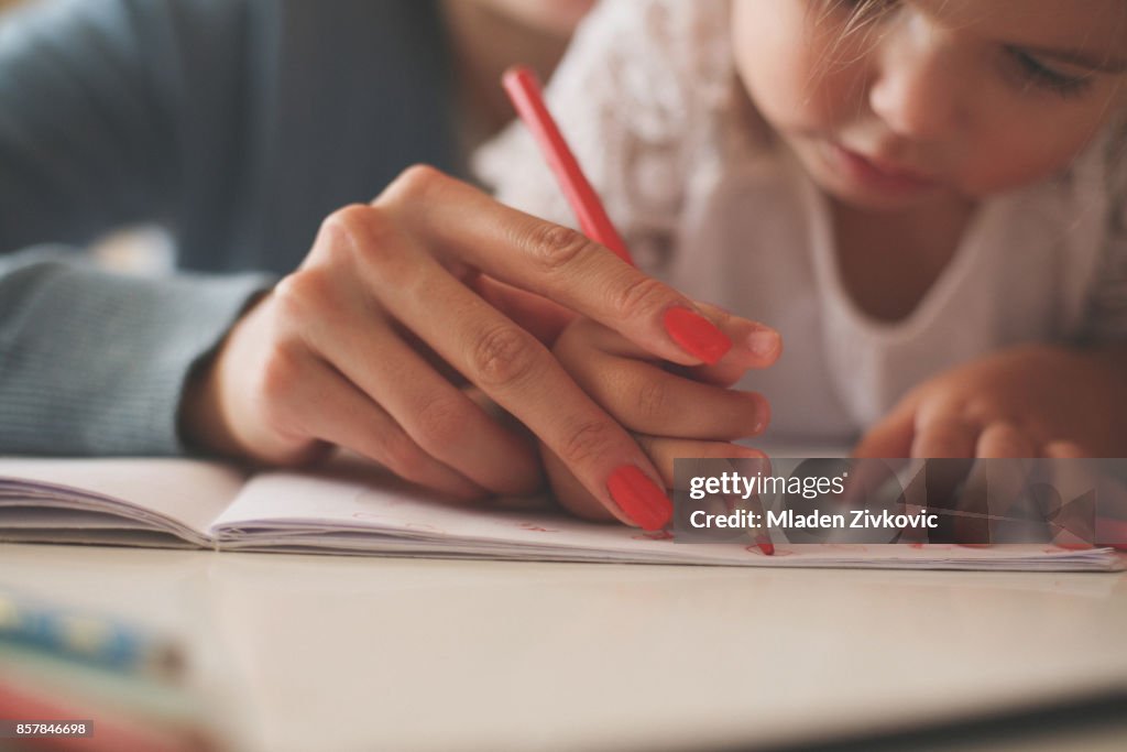 Mother And Daughter At Home Mother Teaching Her Daughter To Drawing And ... Mother And Daughter At Home Mother Teaching Her Daughter To Drawing And ...