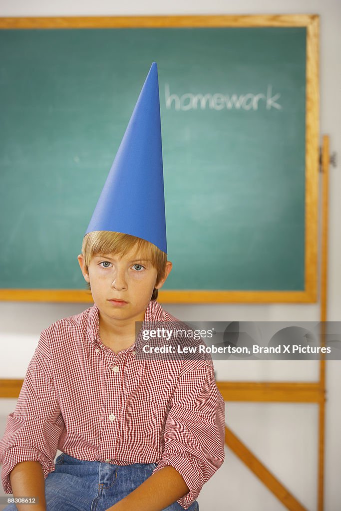 Boy Wearing Dunce Cap High-Res Stock Photo - Getty Images Boy Wearing Dunce Cap High-Res Stock Photo - Getty Images