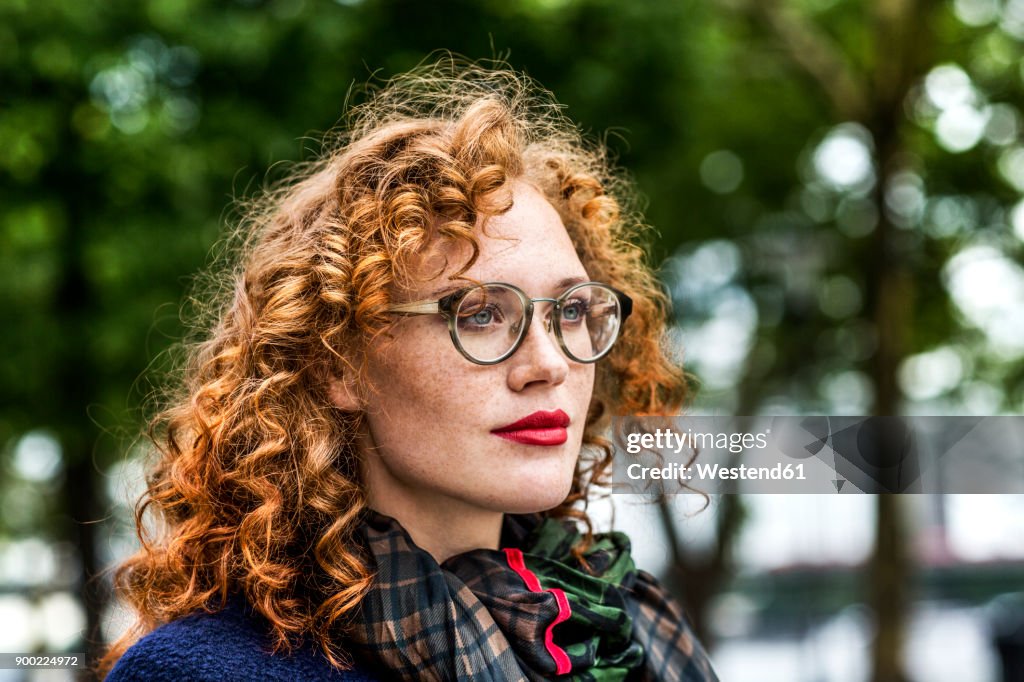 Portrait Of Redheaded Young Woman With Red Lips Wearing Glasses High