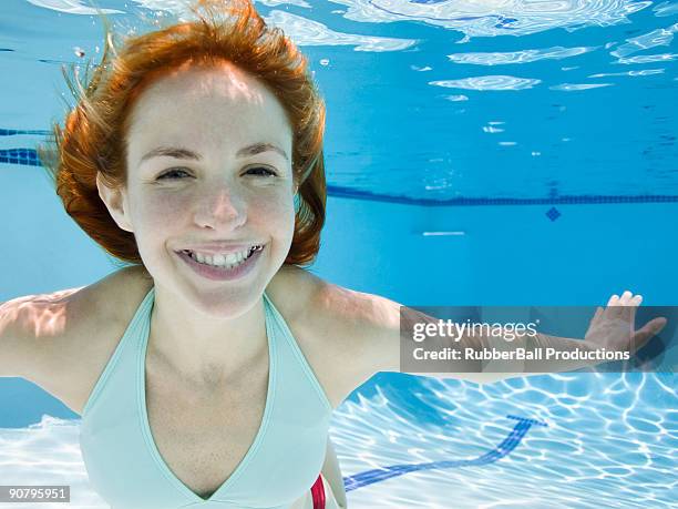 Red Hair Woman Swimming Stock Fotos Und Bilder Getty Images
