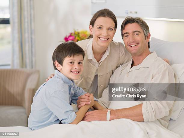 Woman And Man In Bed Facing Camera Sitting Up Photos And Premium High