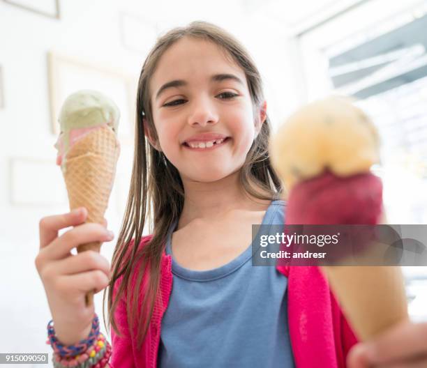 Holding Two Ice Creams Photos And Premium High Res Pictures Getty Images