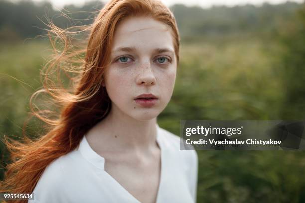 Beautiful Woman In Nature With The Wind Blowing Her Hair Fotografías E
