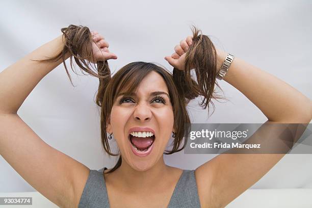 Pulling Up Hair Photos And Premium High Res Pictures Getty Images