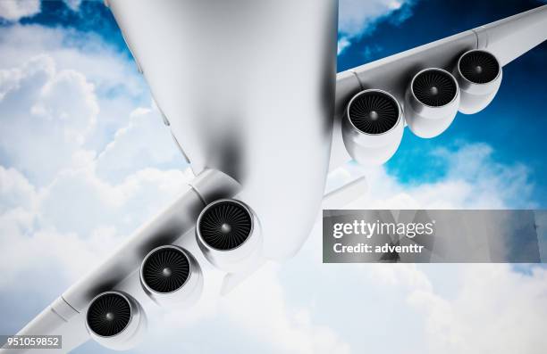 Airplane wing and engines detail on blue sky 이미지 (951059852) - 게티이미지뱅크