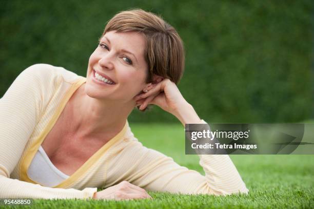 Mature Woman Laying Grass Photos And Premium High Res Pictures Getty