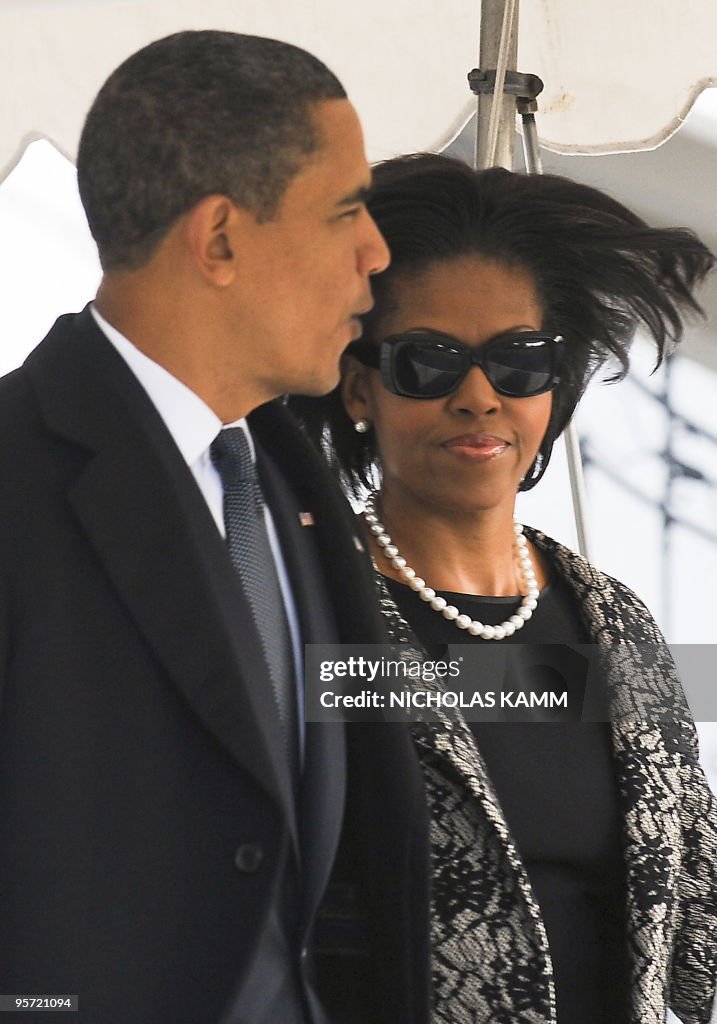 Us President Barack Obama And His Wife Michelle Walk Out Of The News