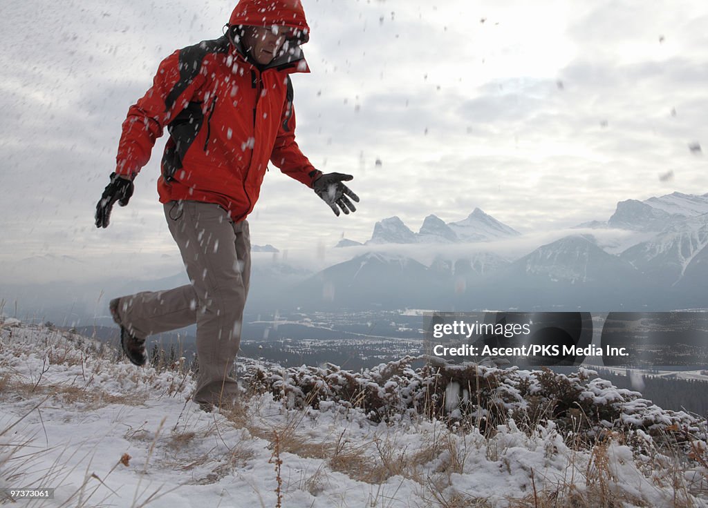 Man Walks Through Snowstorm On Mountain Trail High-Res Stock Photo ... Man Walks Through Snowstorm On Mountain Trail High-Res Stock Photo ...
