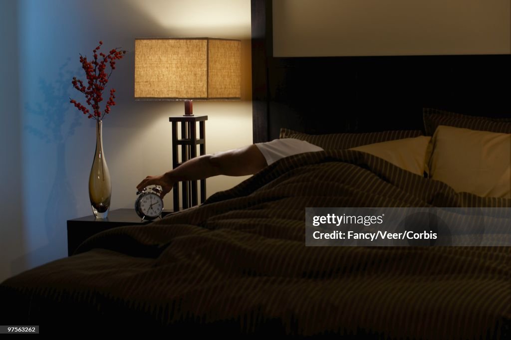 Man Setting Alarm Clock High-Res Stock Photo - Getty Images Man Setting Alarm Clock High-Res Stock Photo - Getty Images