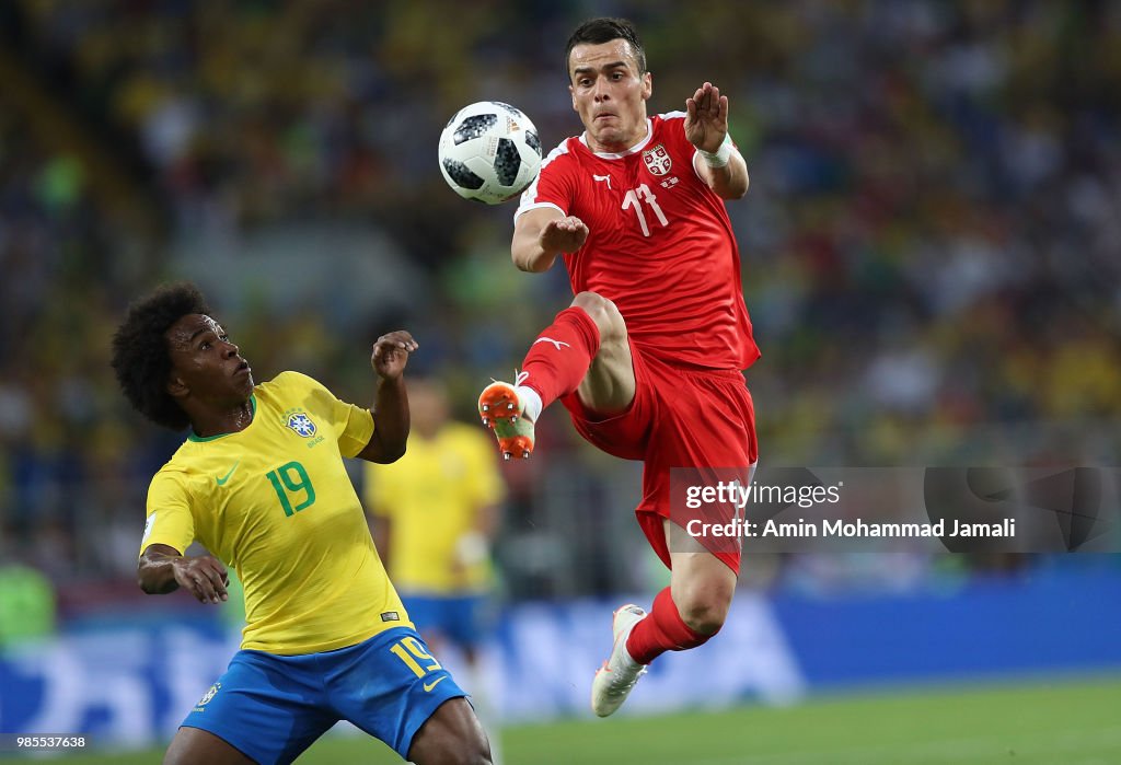 Willian Of Brazil And Aleksandar Kolarof Of Serbia In Action During