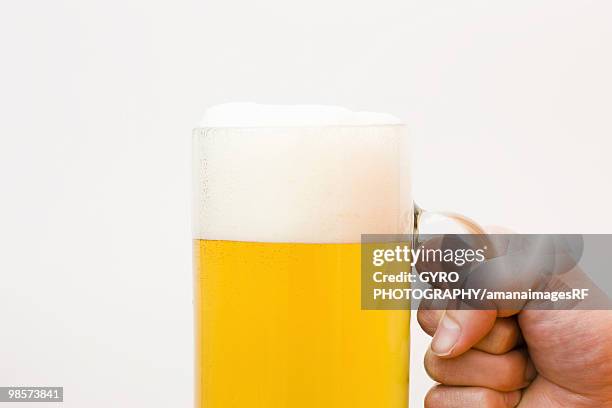 Hand Holding Beer Glass White Background Stock Fotos Und Bilder Getty