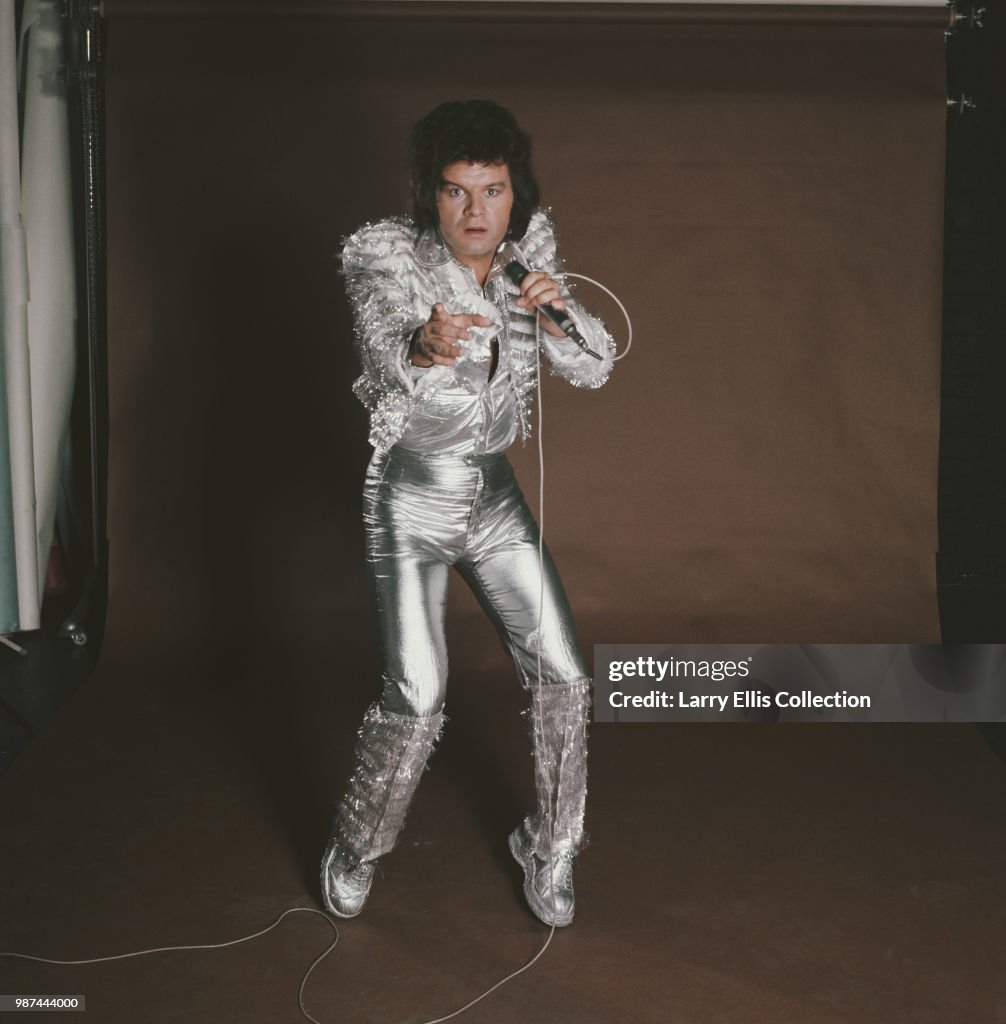 English Pop And Glam Rock Singer Gary Glitter Posed Wearing Silver