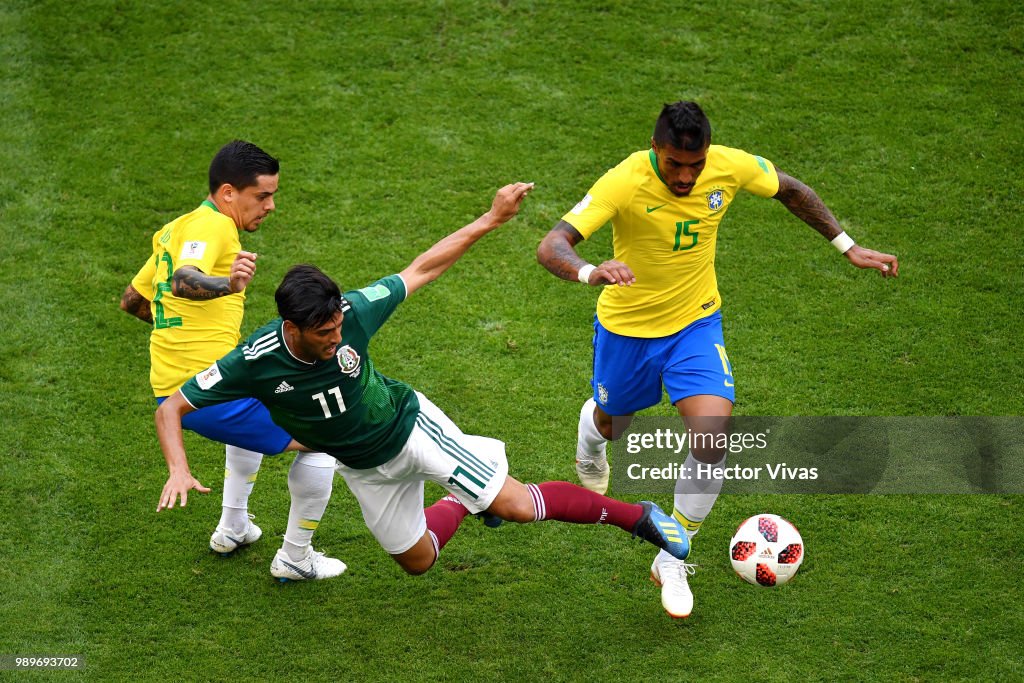 Carlos Vela Of Mexico Tackles Paulinho Of Brazil During The 2018 Fifa