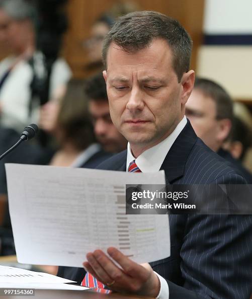 Deputy Assistant FBI Director Peter Strzok looks at a paper handed to ... Deputy Assistant FBI Director Peter Strzok looks at a paper handed to ...