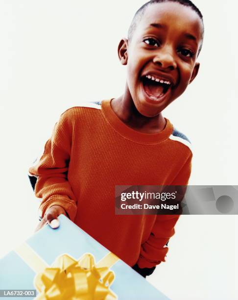 Black Boy Gift Photos And Premium High Res Pictures Getty Images black-boy-gift-photos-and-premium-high-res-pictures-getty-images