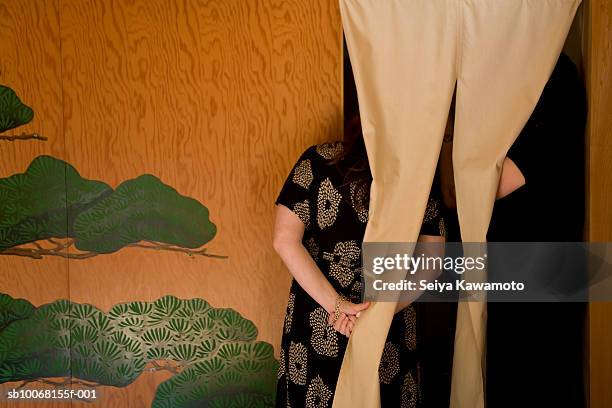 Person Peaking Behind Curtain Photos and Premium High Res Pictures ... Person Peaking Behind Curtain Photos and Premium High Res Pictures ...