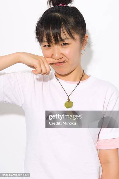 17 Finger Under Nose Stock Photos, High-Res Pictures, and Images ... 17 Finger Under Nose Stock Photos, High-Res Pictures, and Images ...