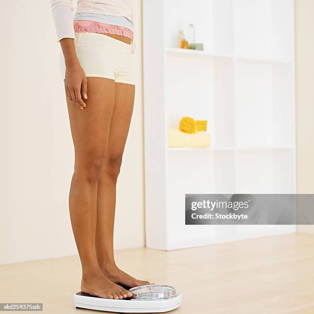 Black Person Standing Scale Photos And Premium High Res Pictures